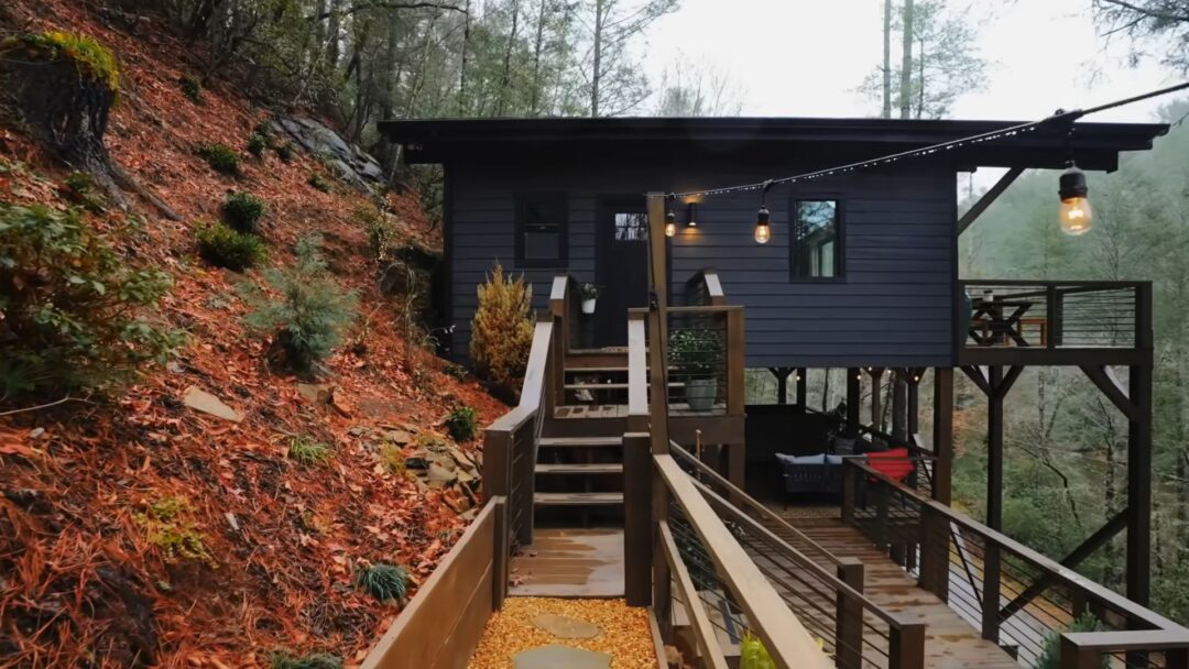 Experience a Riverside Getaway with Blockbuster Vibes in a Tiny Hideaway